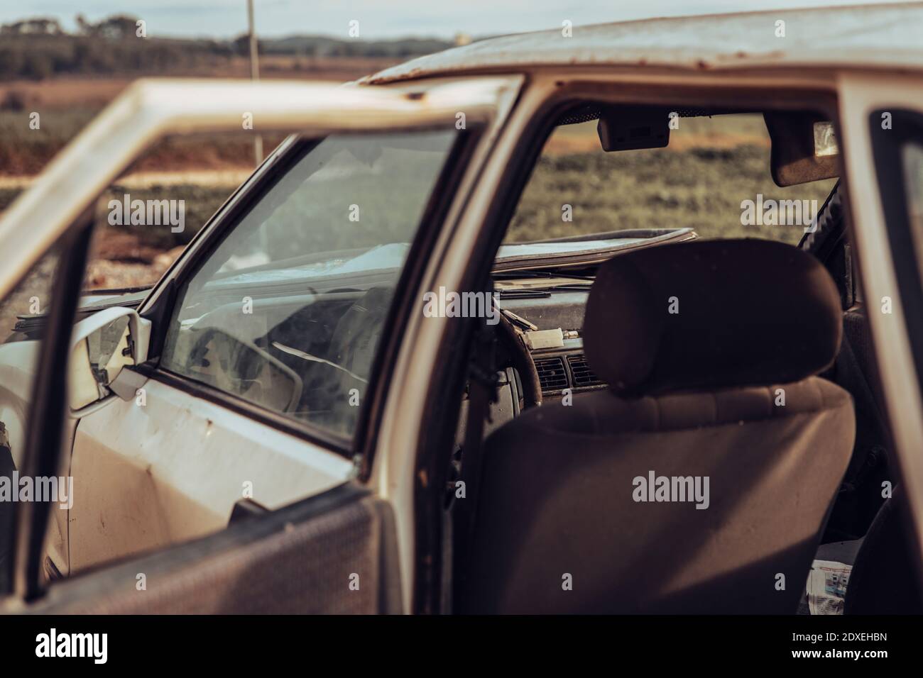 White wrecked car deteriorating outdoors Stock Photo - Alamy