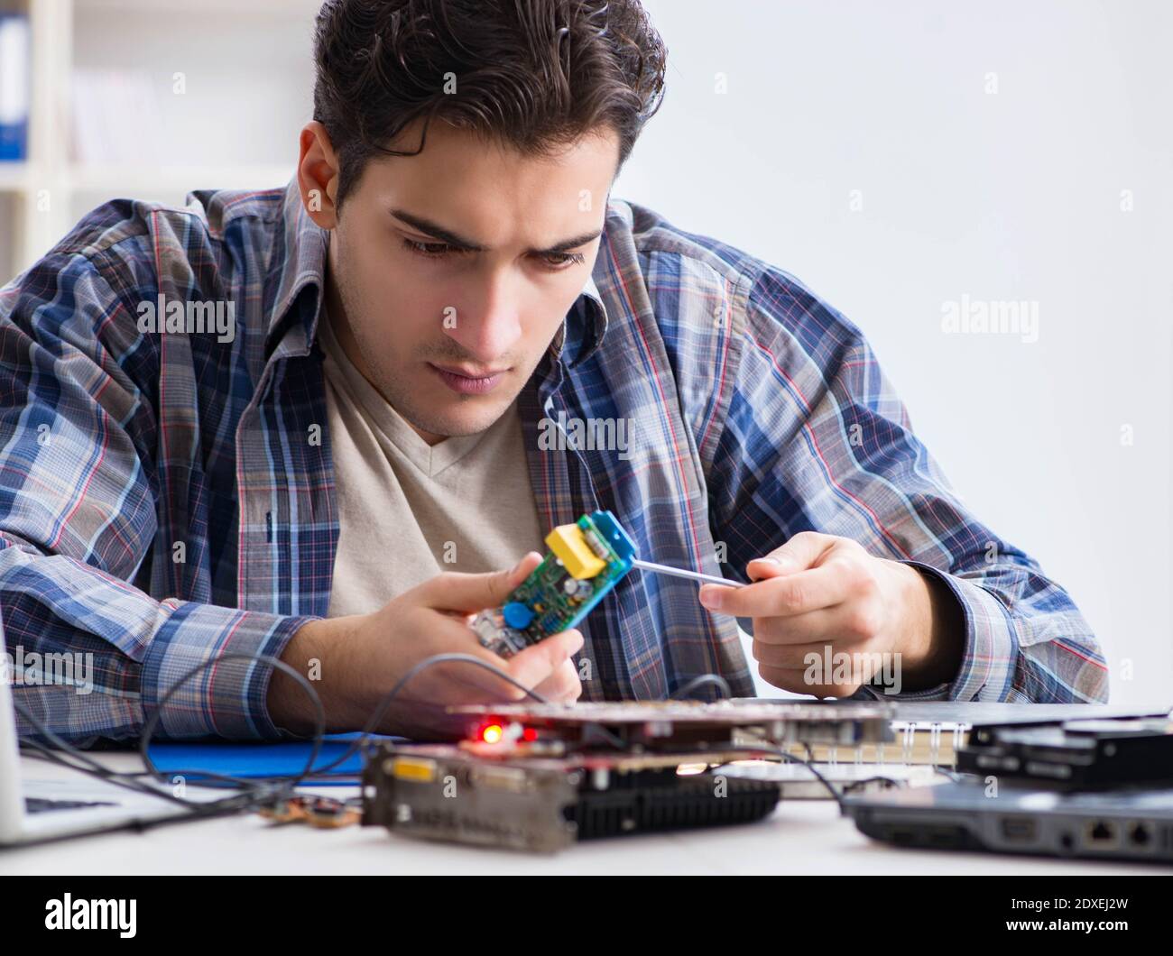 Computer hardware repair and fixing concept by experienced technician ...