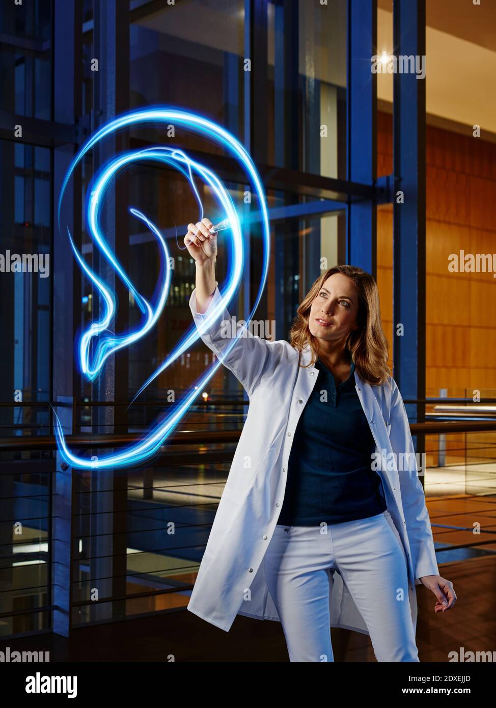 Female doctor analyzing ear in laboratory at hospital Stock Photo - Alamy