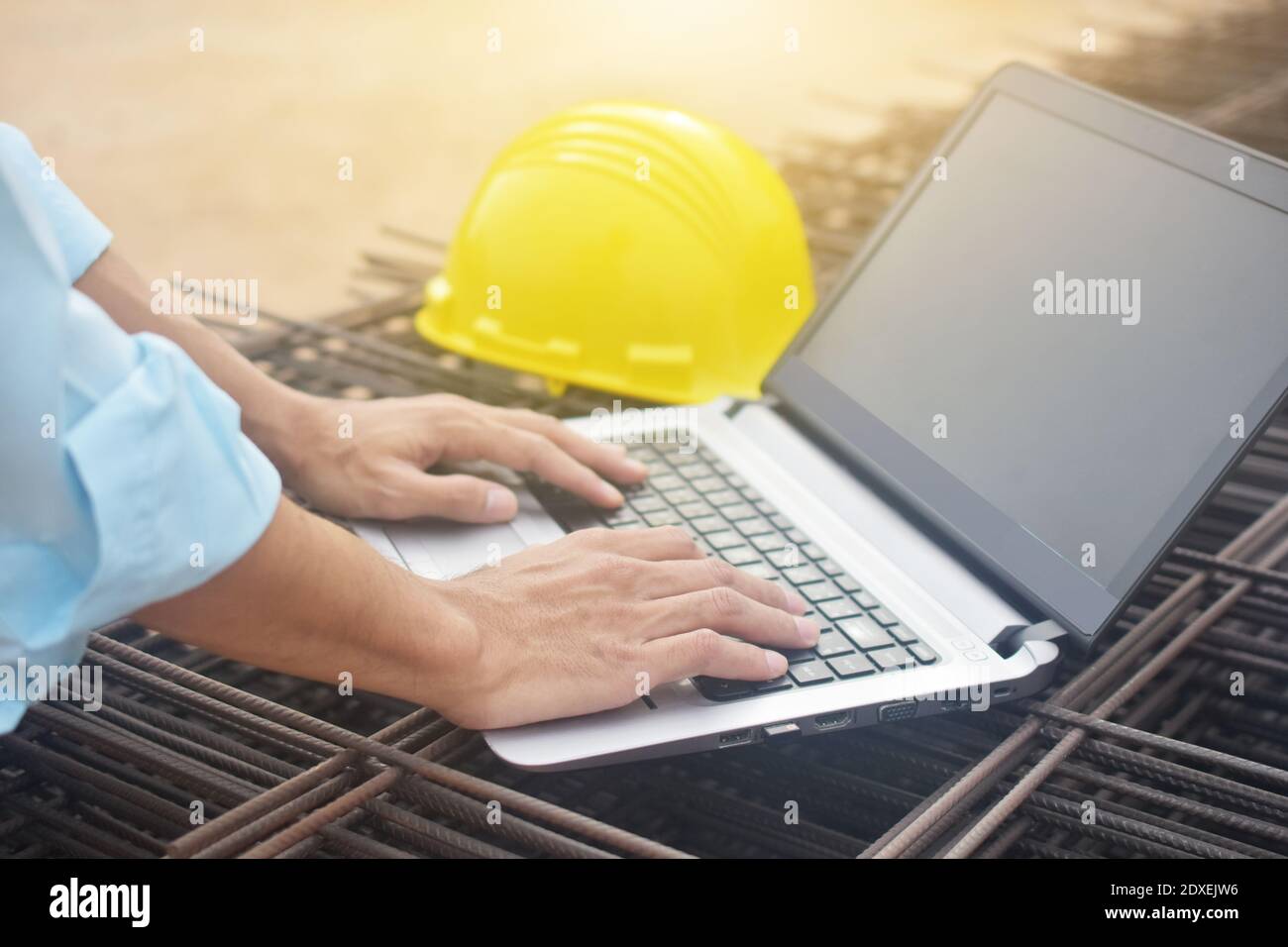 Engineering use computer at work building construction background Stock ...