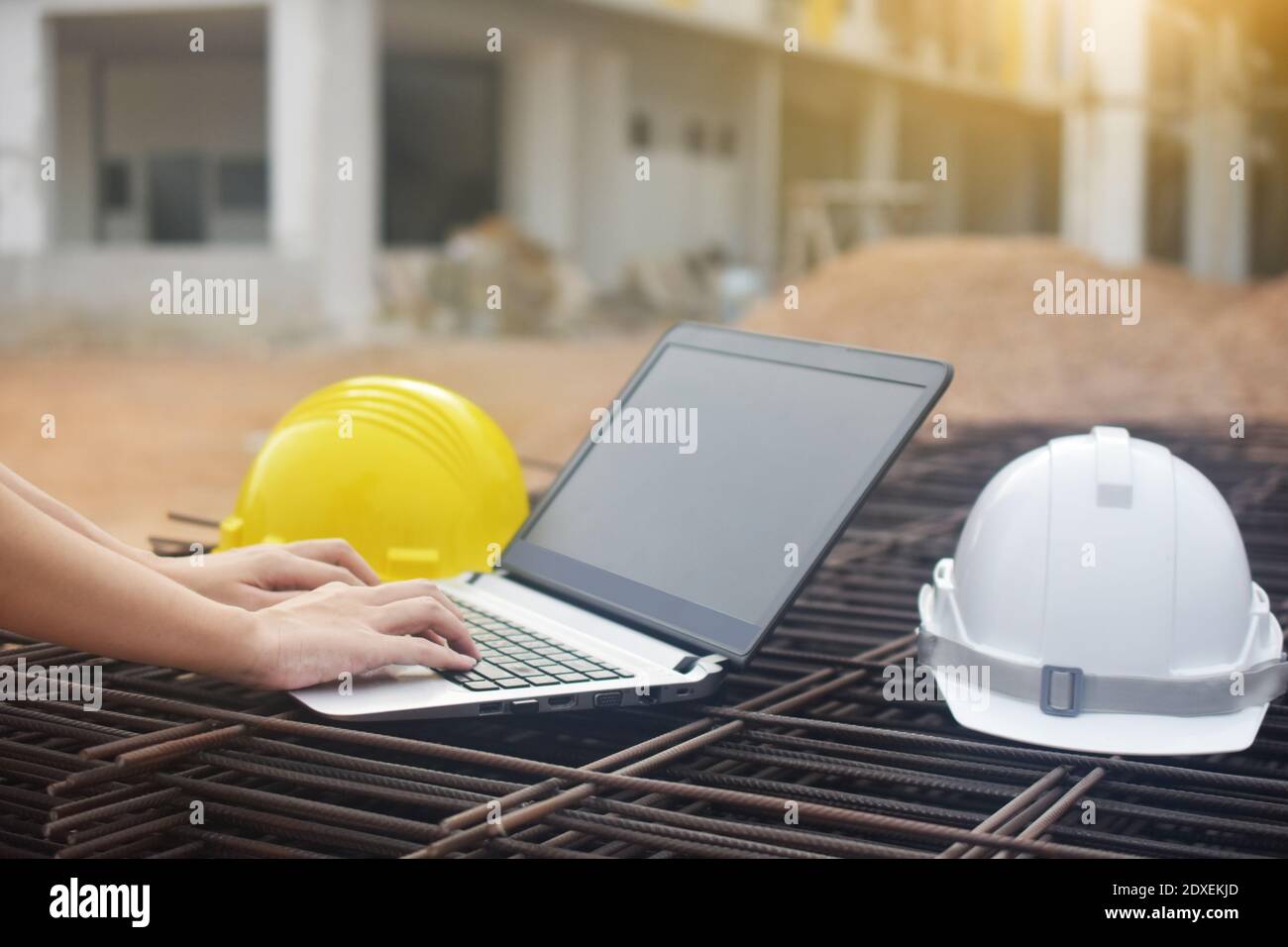 Engineering use computer at work building construction background Stock ...