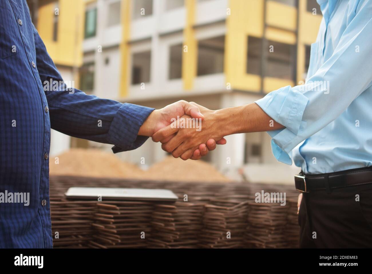 Engineering hands shake at work place building construction estate ...
