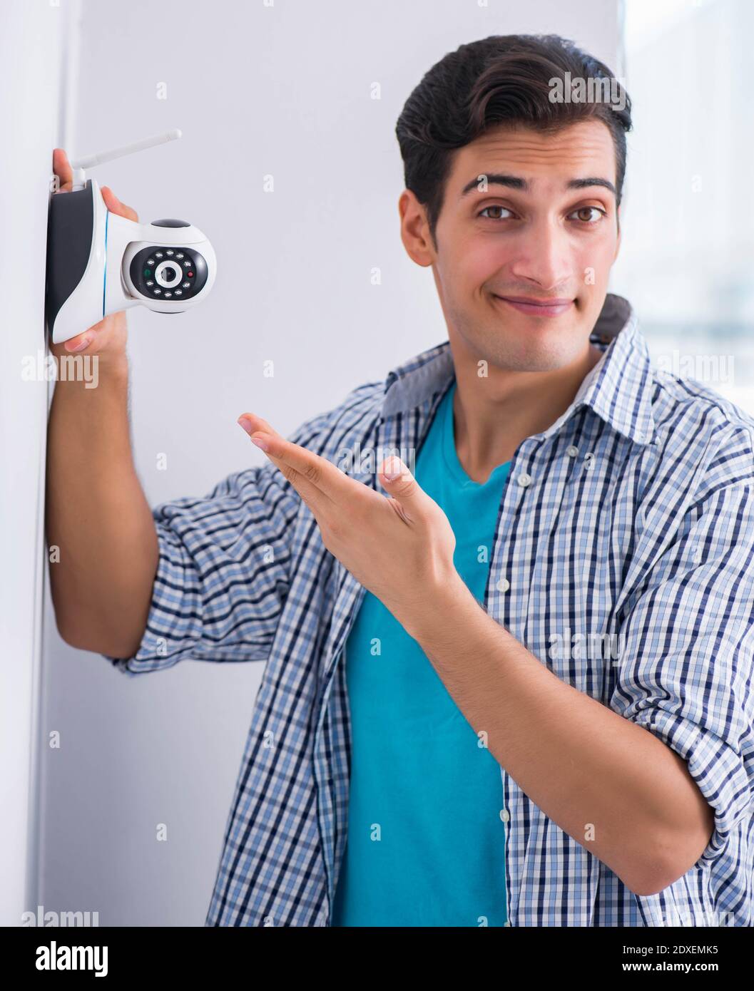 The man installing surveillance cctv cameras at home Stock Photo - Alamy