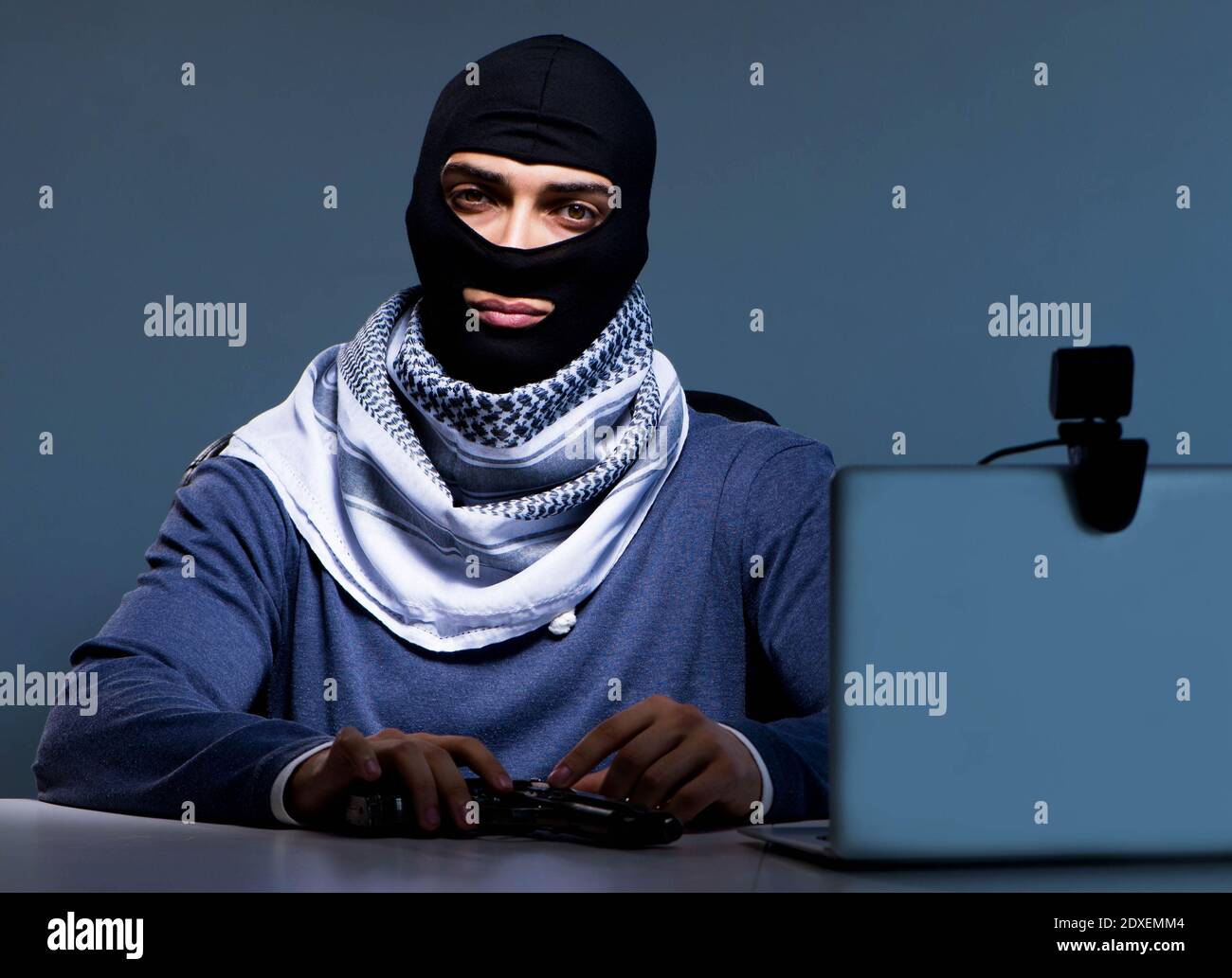 The hacker wearing balaclava mask hacking computer Stock Photo - Alamy