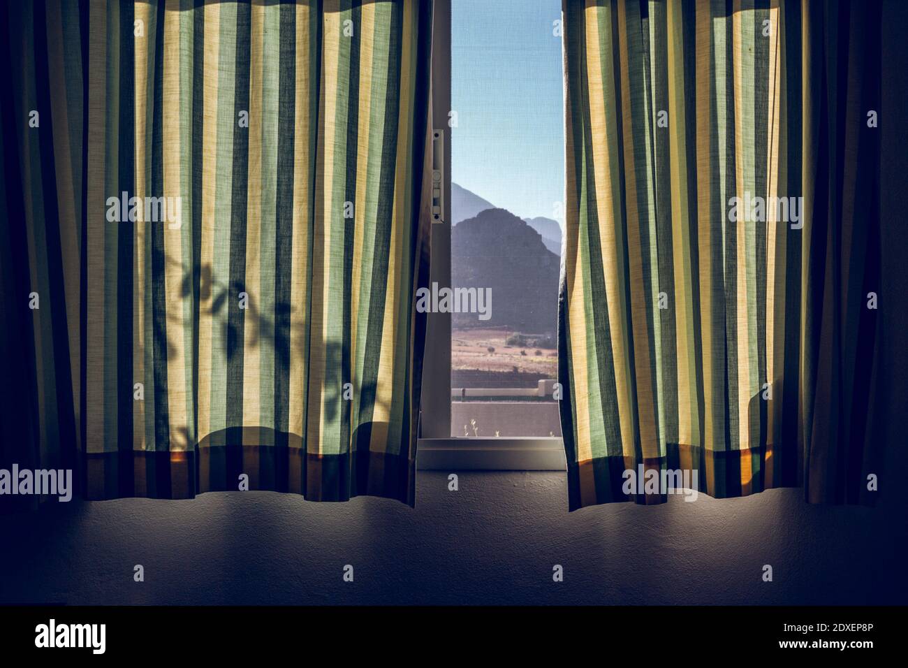 Window covered by green striped curtains Stock Photo - Alamy