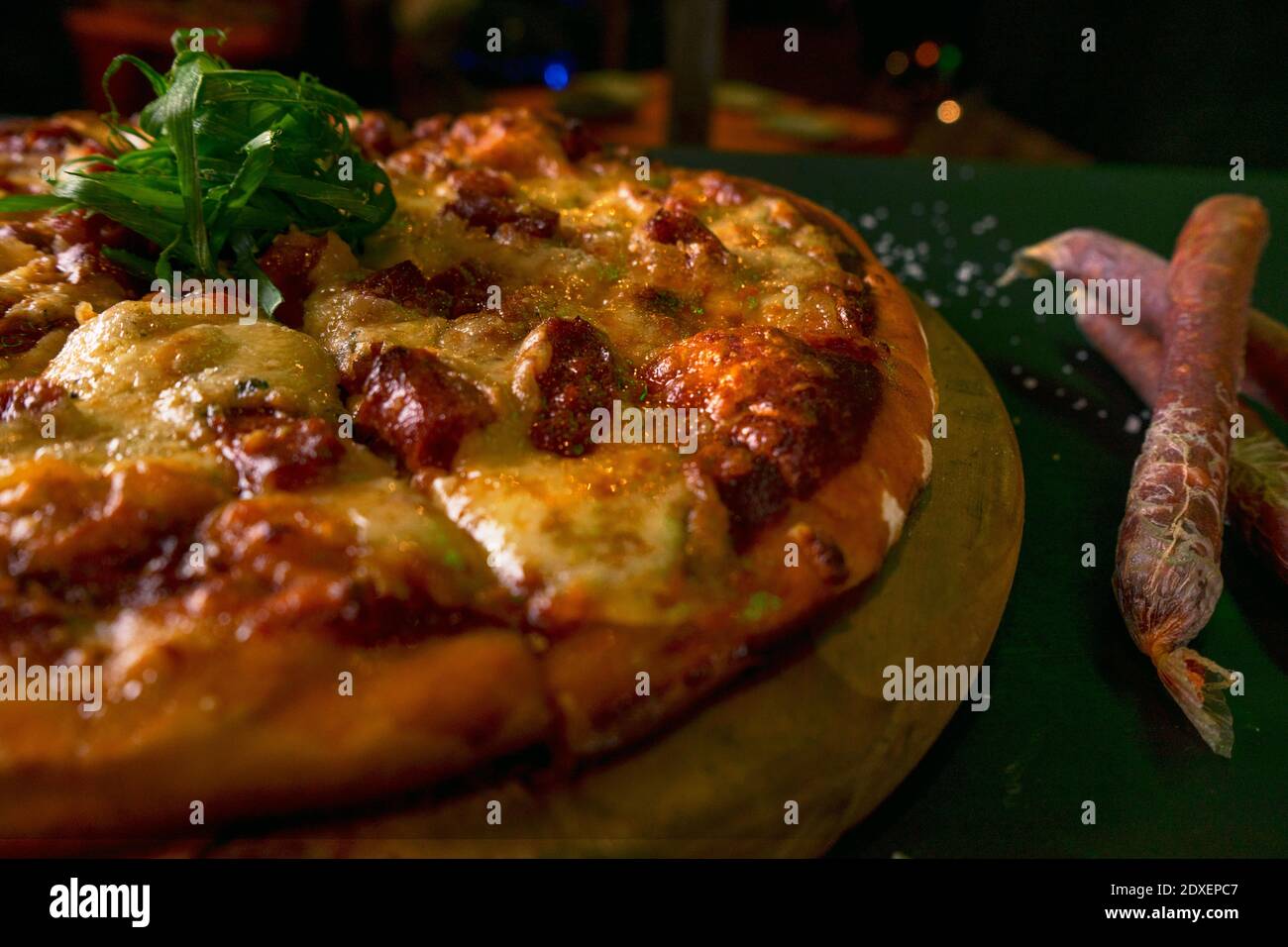 top view Traditional crispy Italian pizza with cheese and chistorras ...