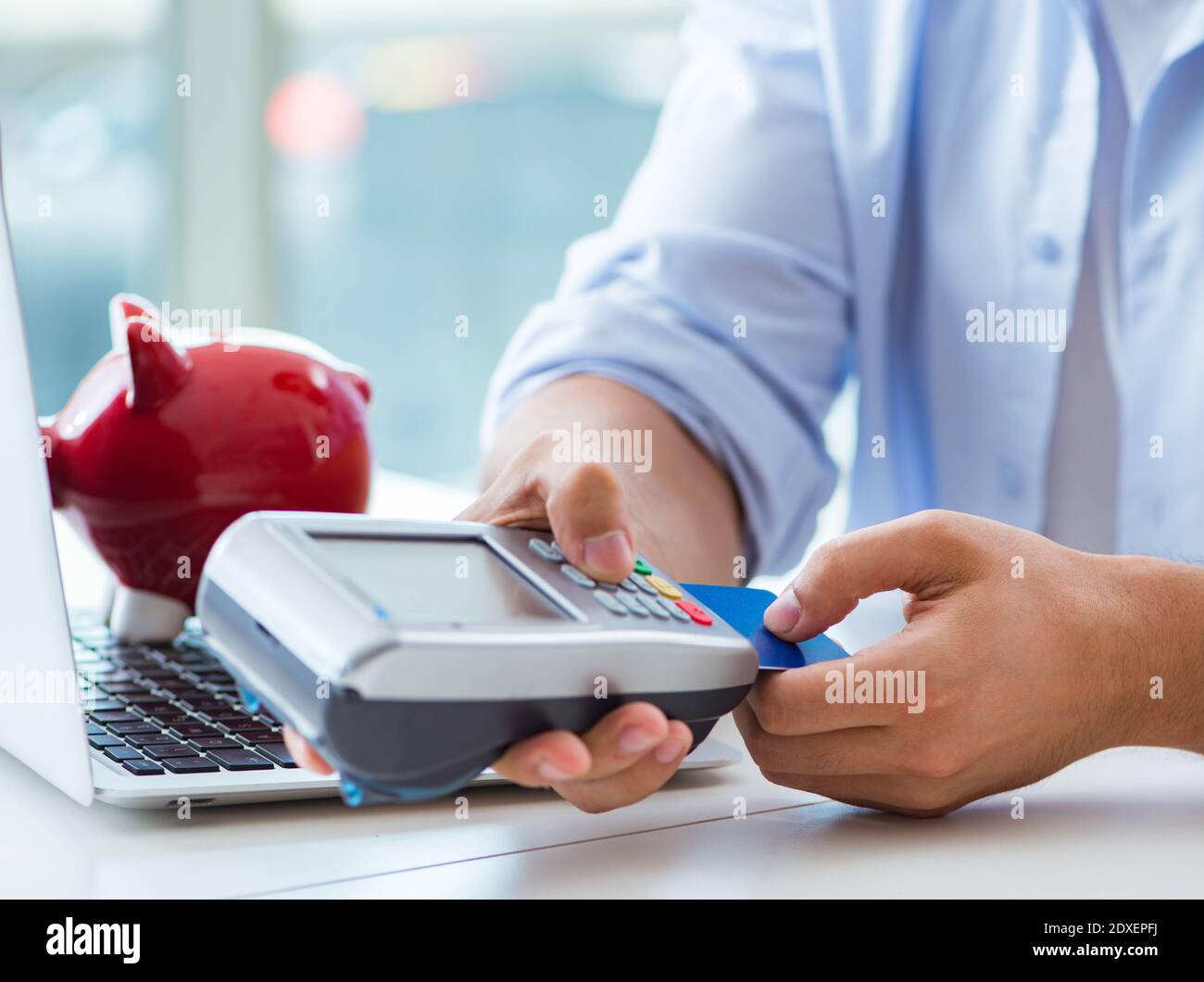 The man processing credit card transaction with pos terminal Stock ...