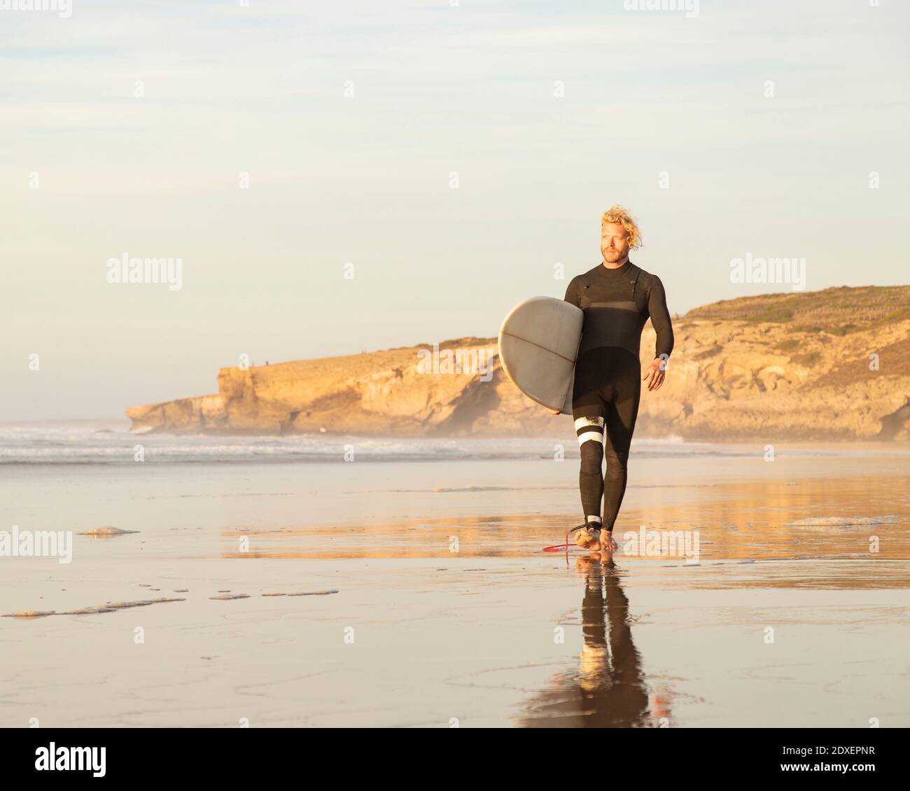 Male walking with surfboard hi-res stock photography and images - Alamy