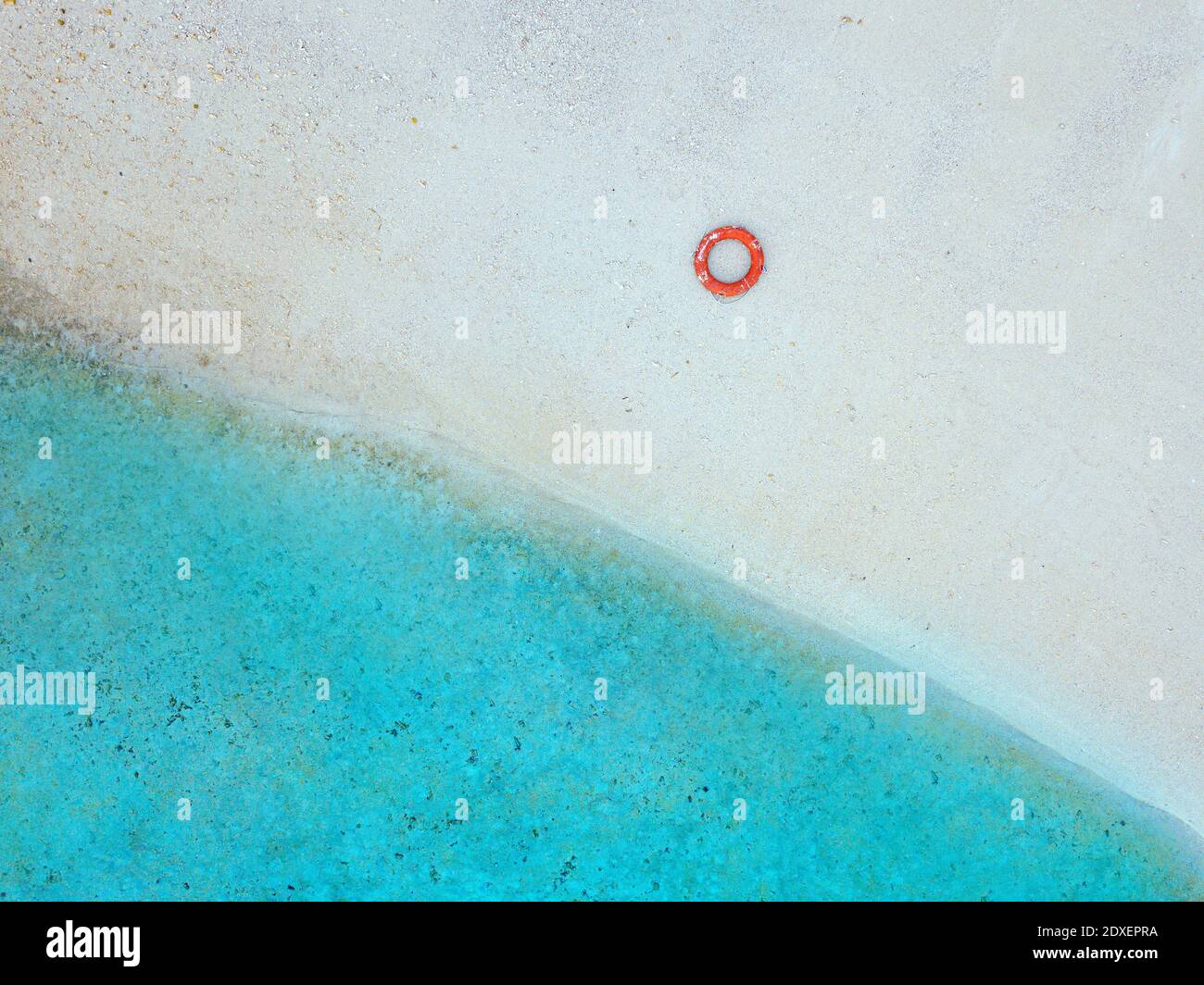 Inflatable ring on shore at beach Stock Photo - Alamy