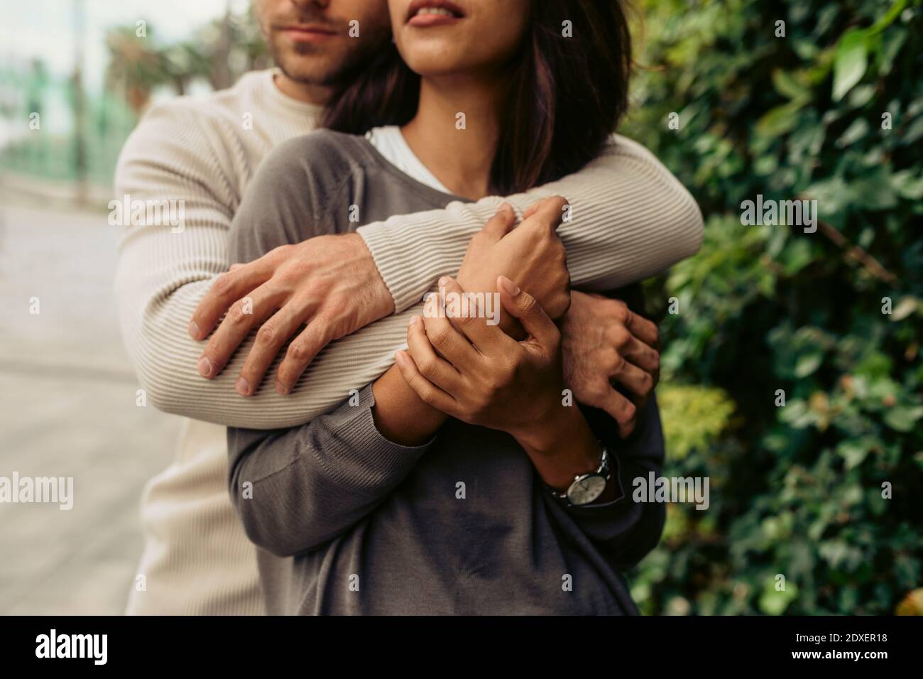 Midsection man embracing girlfriend hi-res stock photography and images ...