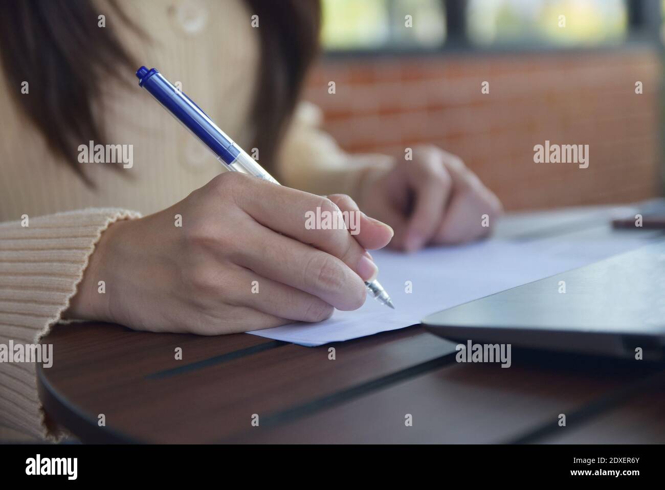 Close up hand business person write pen on document sitting work ...