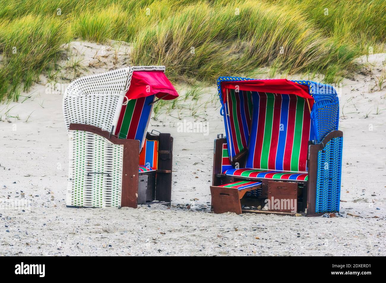 Old fashioned hooded beach chairs on beach Stock Photo - Alamy