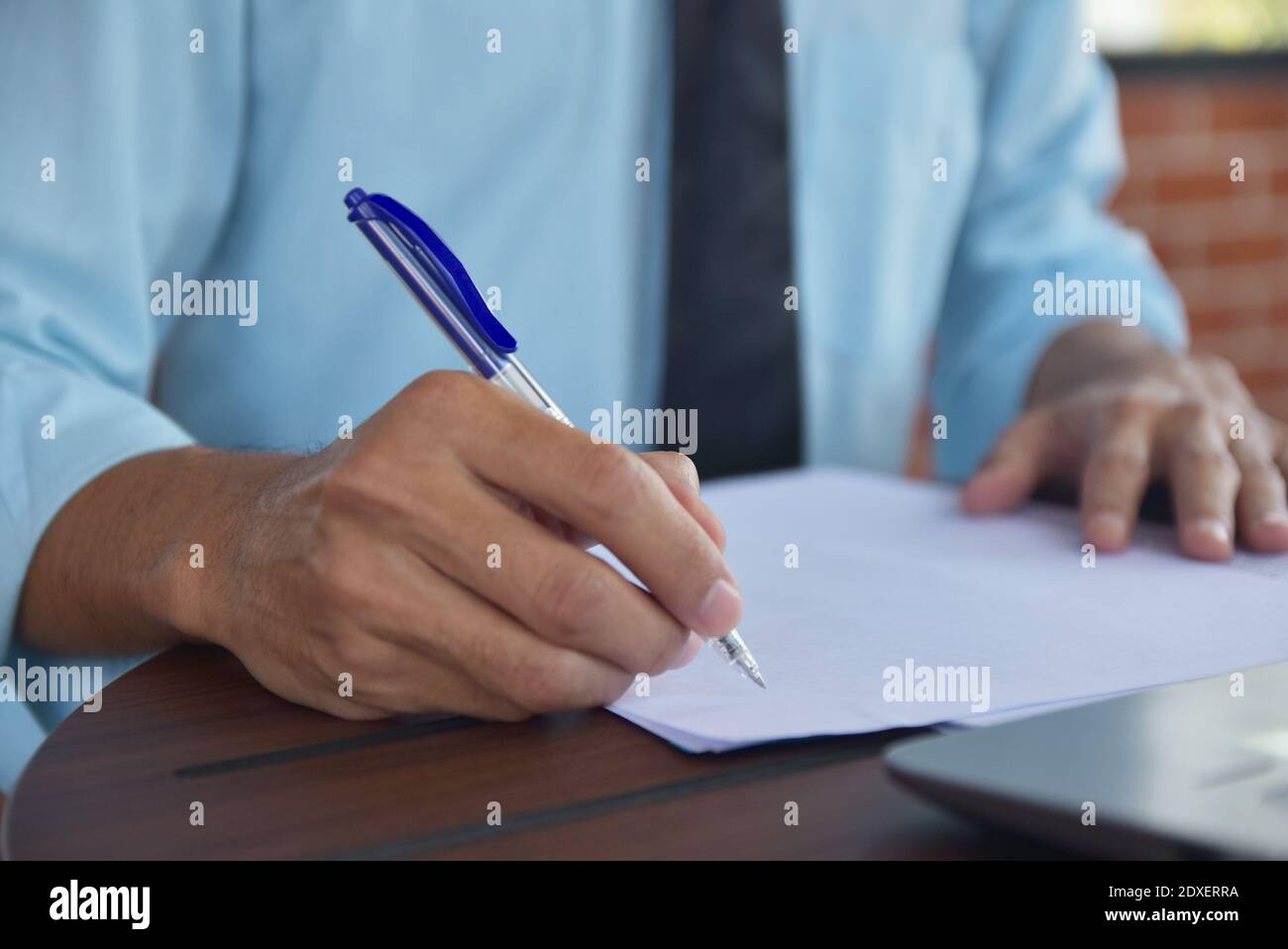 Close up hand business person write pen on document sitting work ...