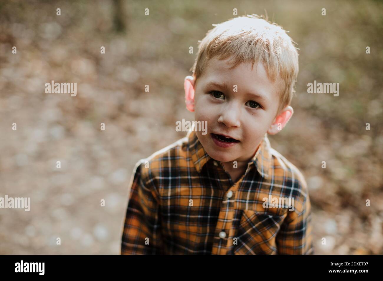 Child boy looking at camera staring hi-res stock photography and images ...