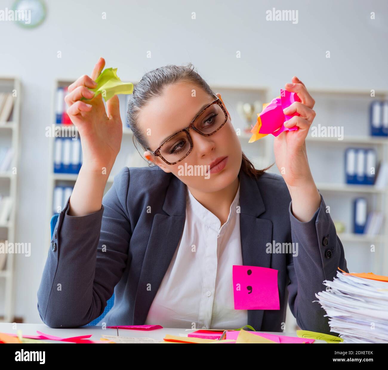 The businesswoman with conflicting priorities in office Stock Photo - Alamy