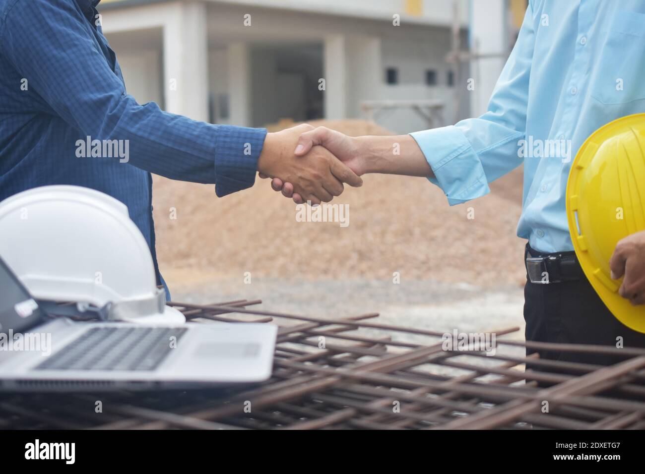 Businessman Shaking hands is a business promise in project building ...