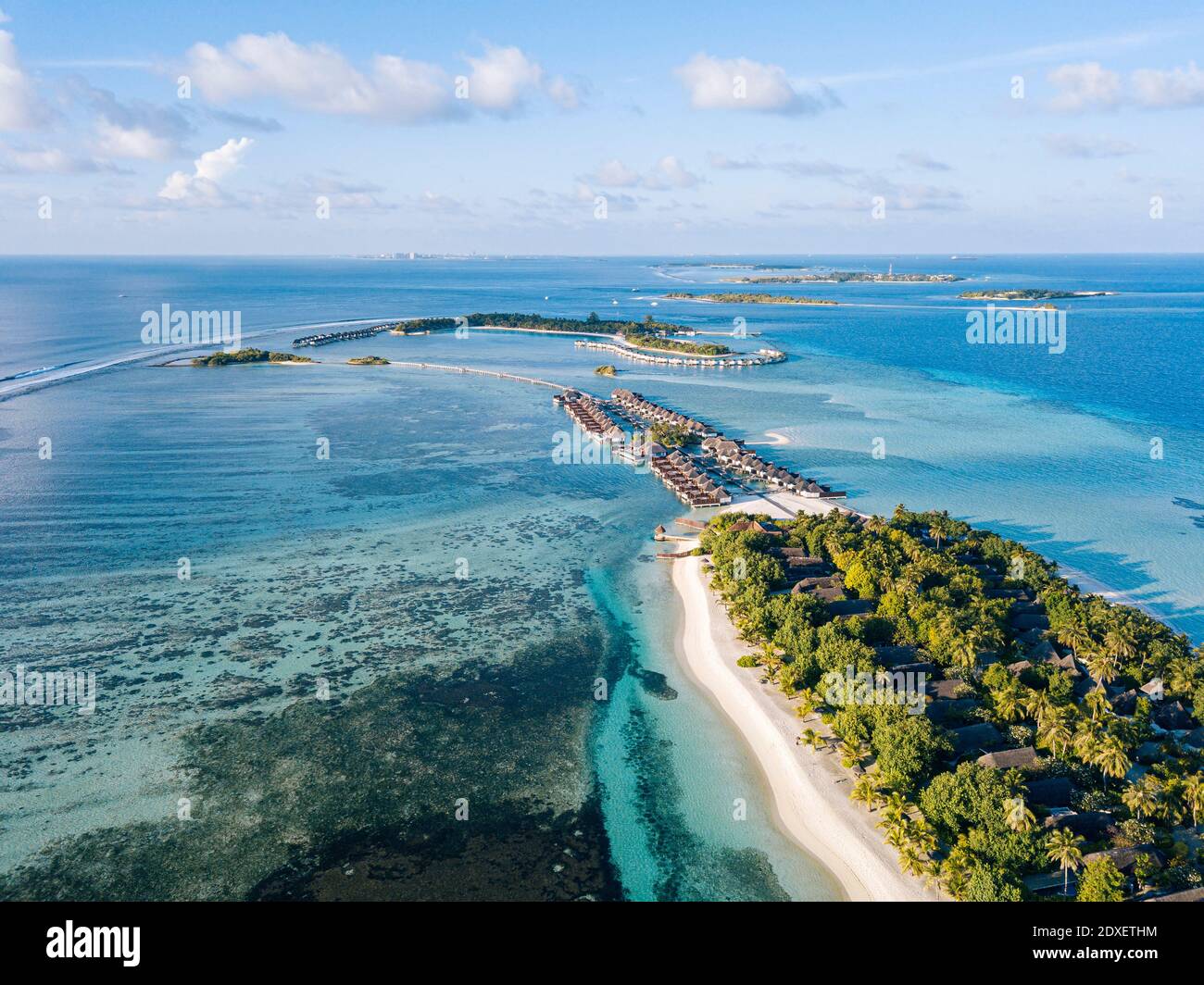 Maldives, Kaafu Atoll, Aerial view of green grove on Huraa island Stock ...