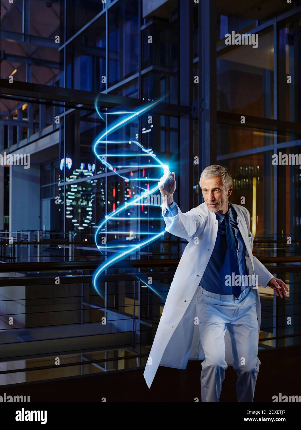 Male doctor light painting DNA in laboratory at hospital Stock Photo ...