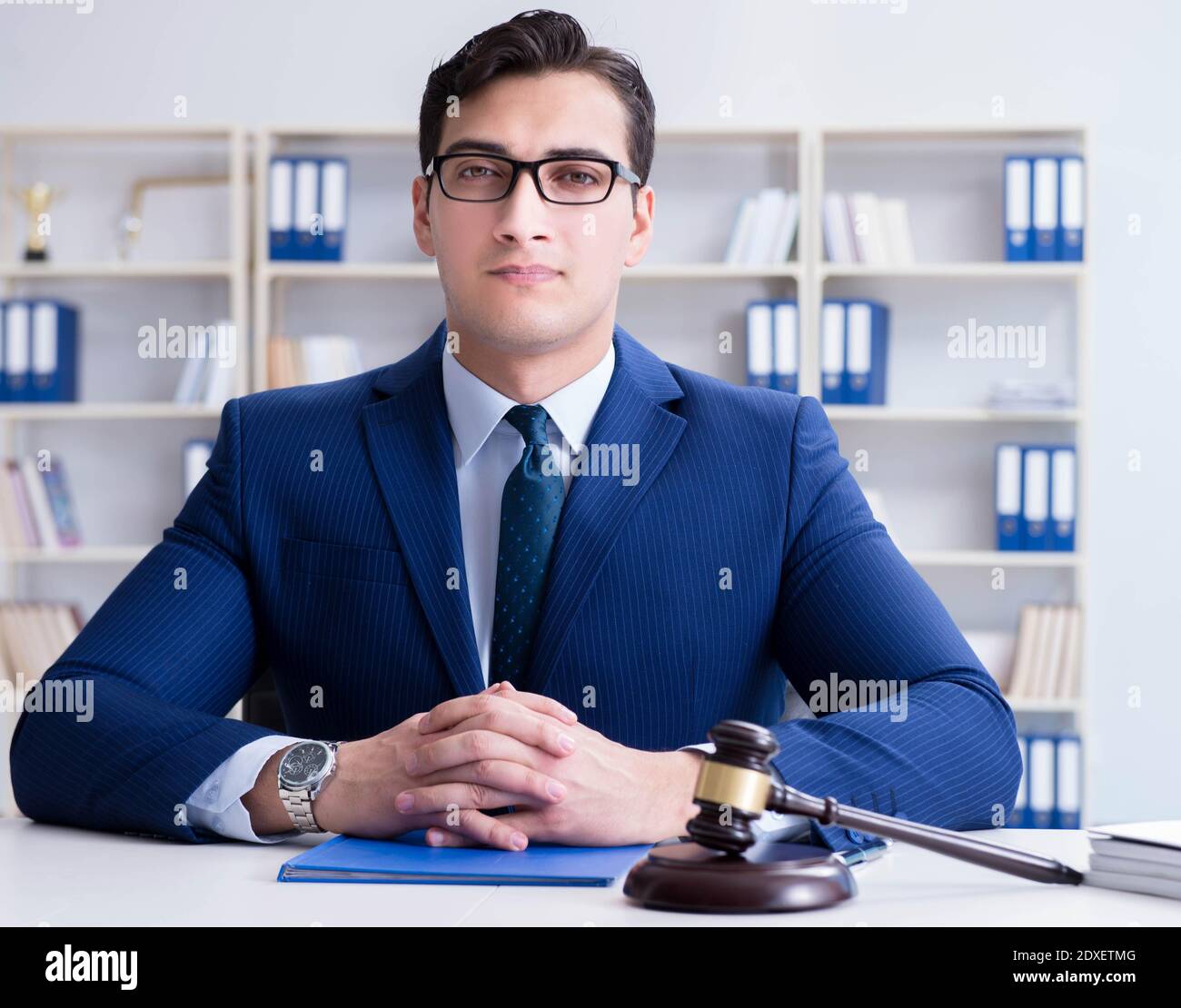 The young lawyer judge sitting in the office Stock Photo - Alamy