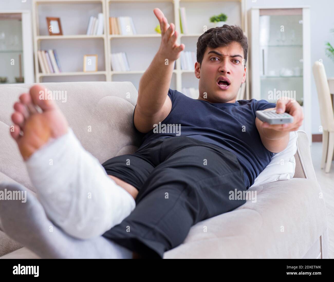 The man with broken leg recovering at home Stock Photo - Alamy