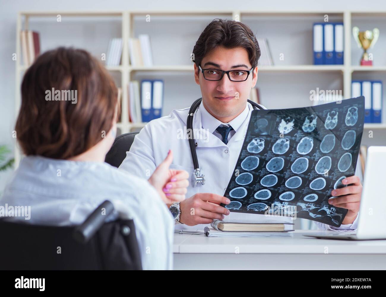 The doctor explaining to patient results of x-ray imaging Stock Photo ...