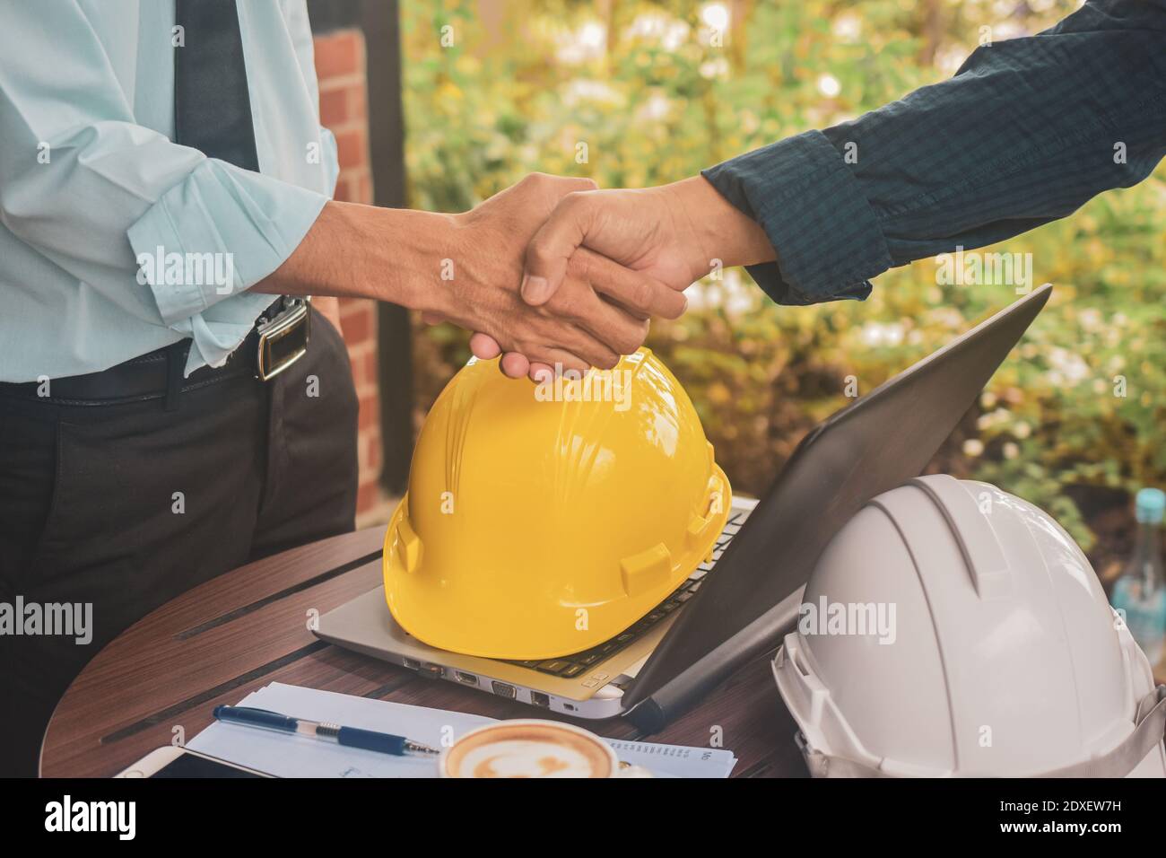 Engineering hands shake at work place building construction estate ...