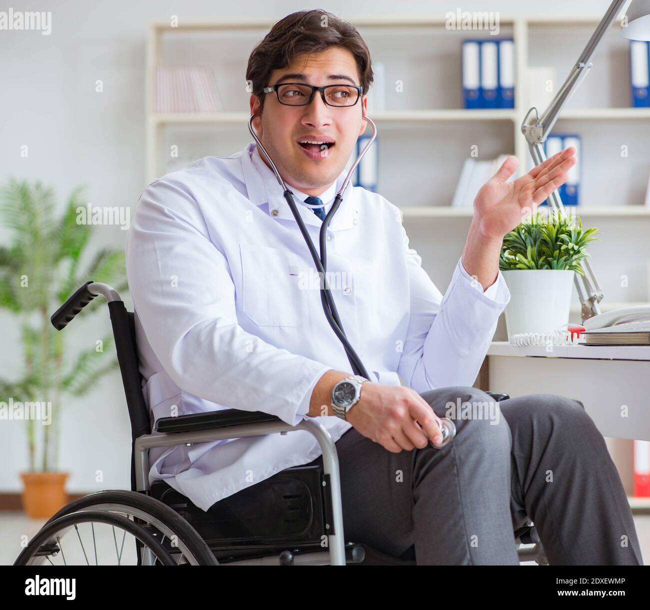 The disabled doctor on wheelchair working in hospital Stock Photo - Alamy