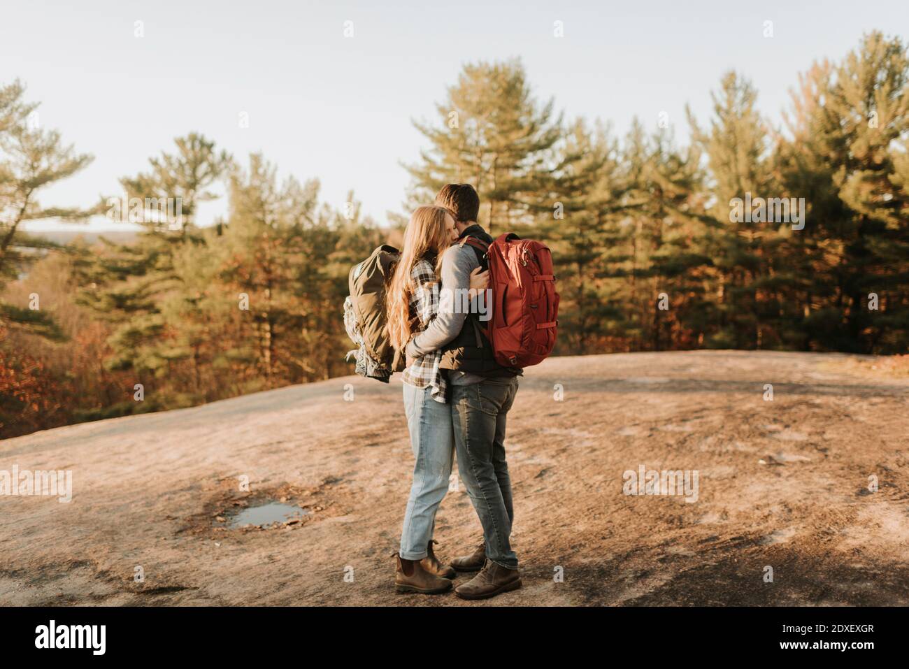 Young couple embracing during autumn hike Stock Photo - Alamy