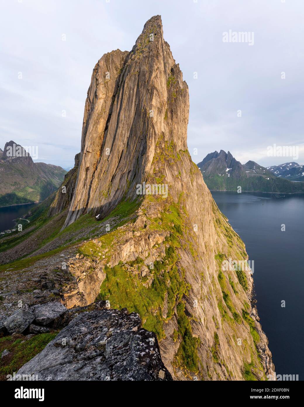 Tall peak of Segla mountain against sky at Norway Stock Photo - Alamy