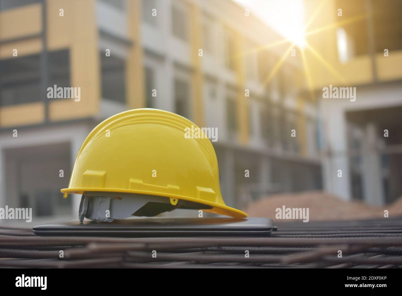 Hard hat safety on computer notebook building construction estate ...