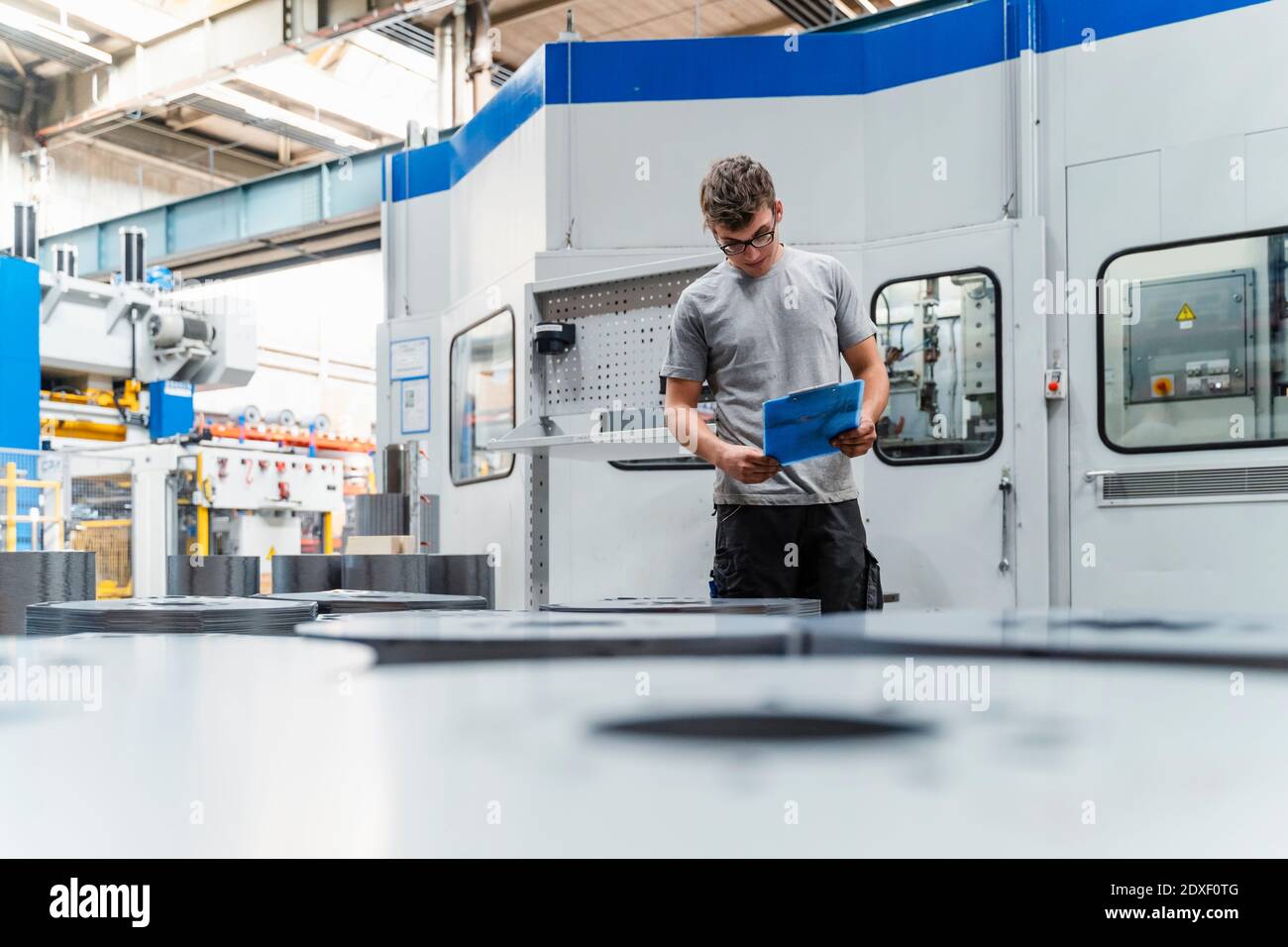 Standing examining holding uniform hi-res stock photography and images ...