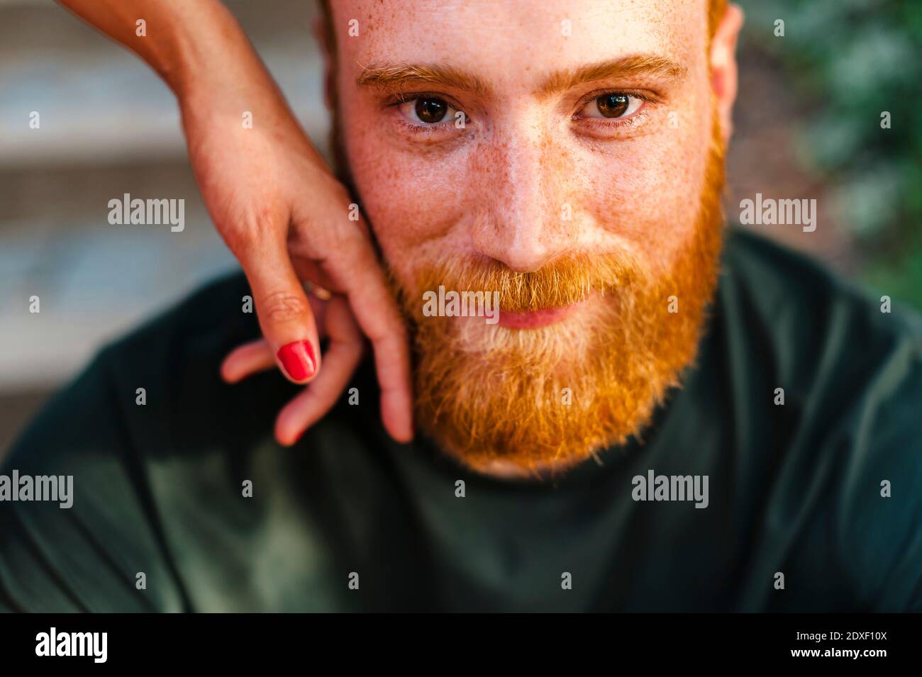 Woman touching boyfriend face with hand hi-res stock photography and ...