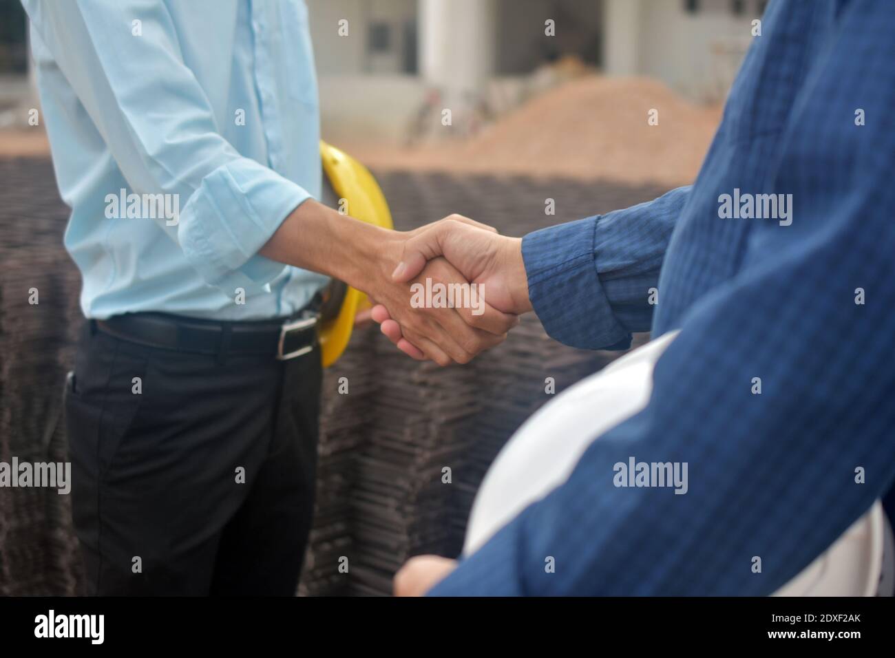 Engineering hands shake at work place building construction estate ...