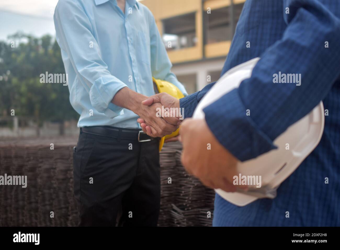 Engineering hands shake at work place building construction estate ...