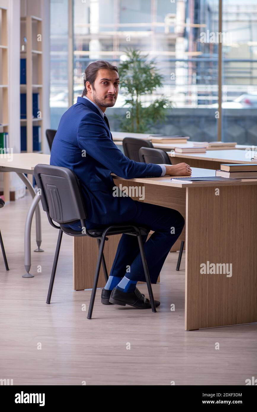 Young teacher in suit in the classroom Stock Photo - Alamy
