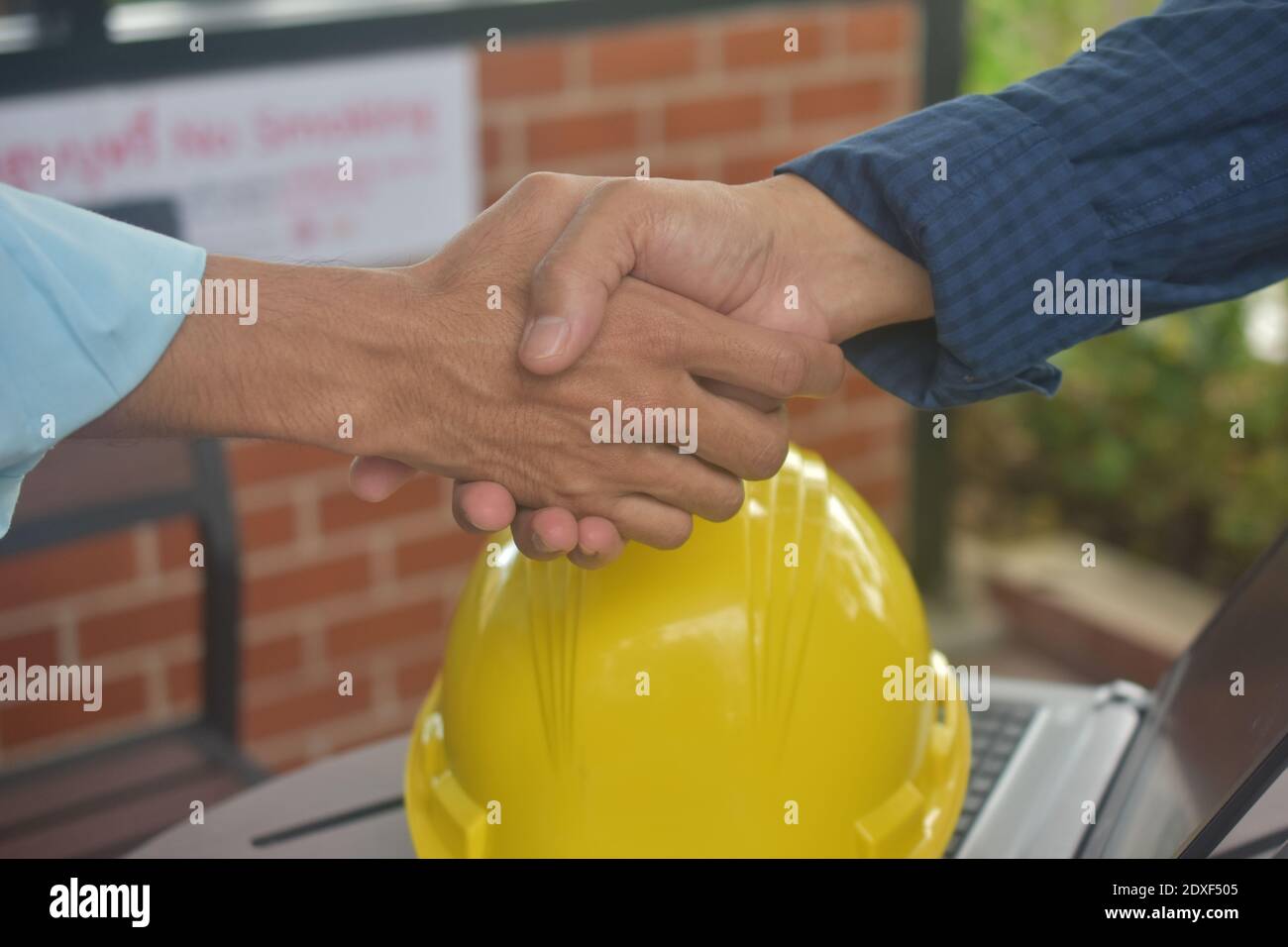 Engineering hands shake at work place building construction estate ...