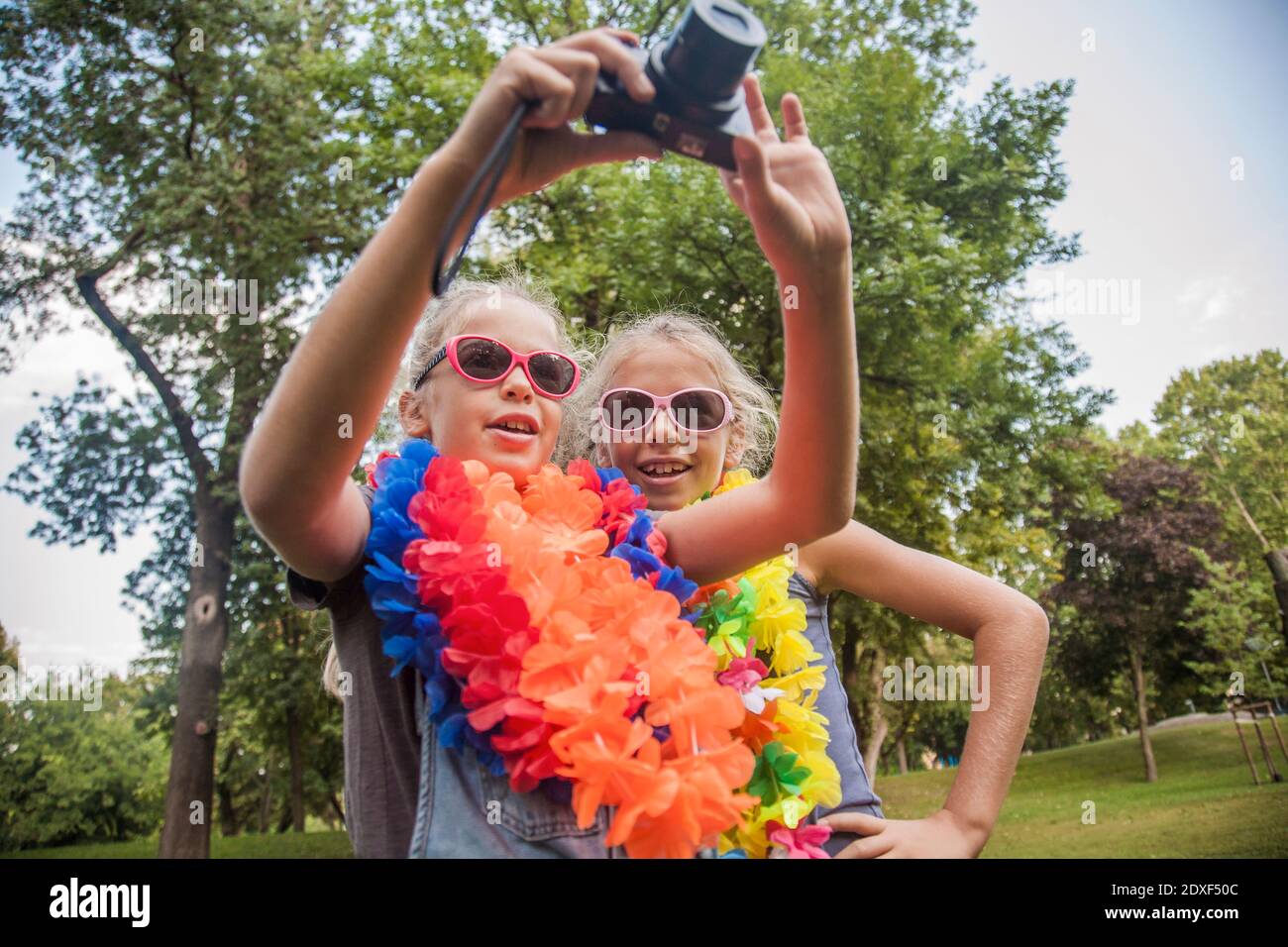 Children taking photos of each other in the park, Budapest, Hungary ...