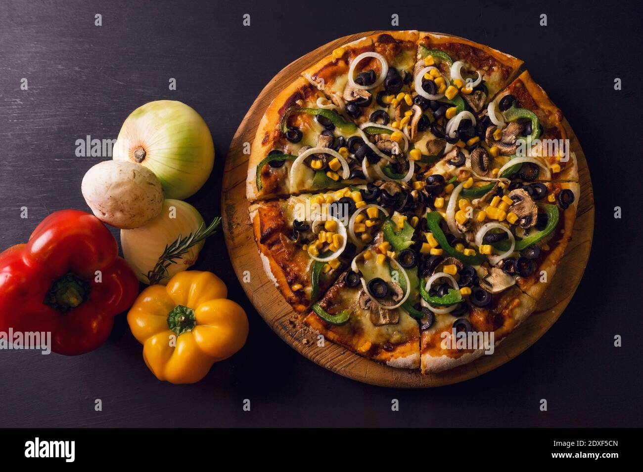 top view authentic Italian Pizza with black olives and vegetable rustic ...
