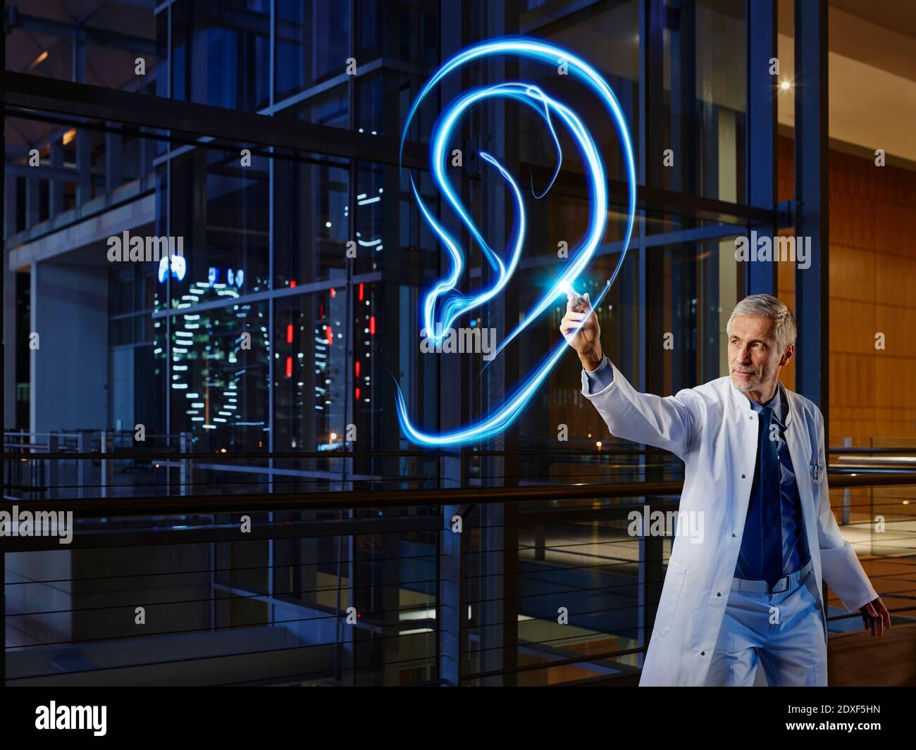 Male otolaryngologist examining ear in laboratory at hospital Stock ...
