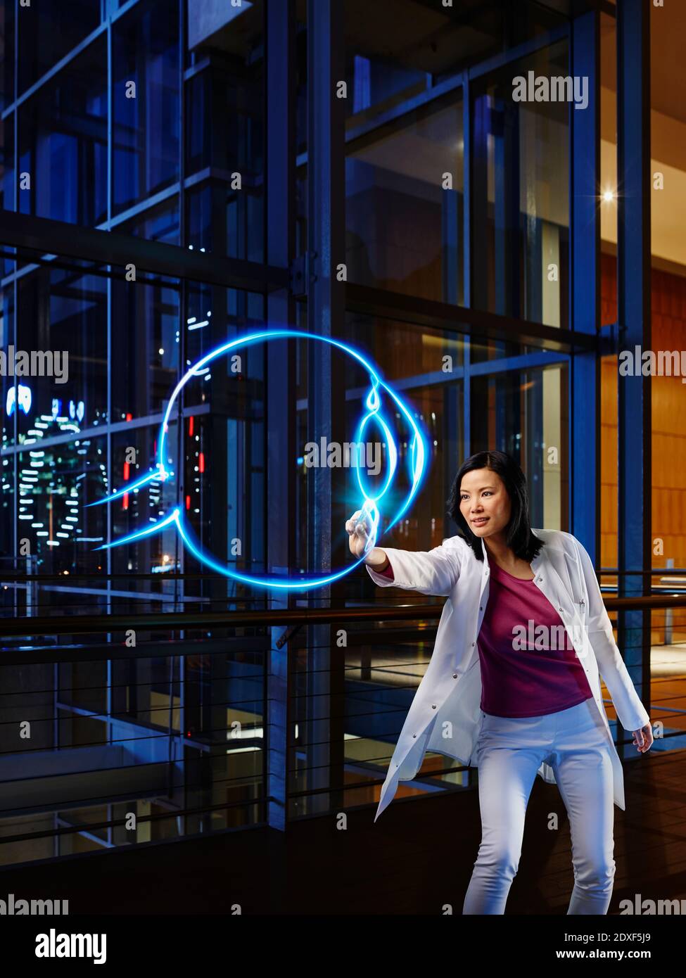 Female ophthalmologist examining eyeball with light painting in ...