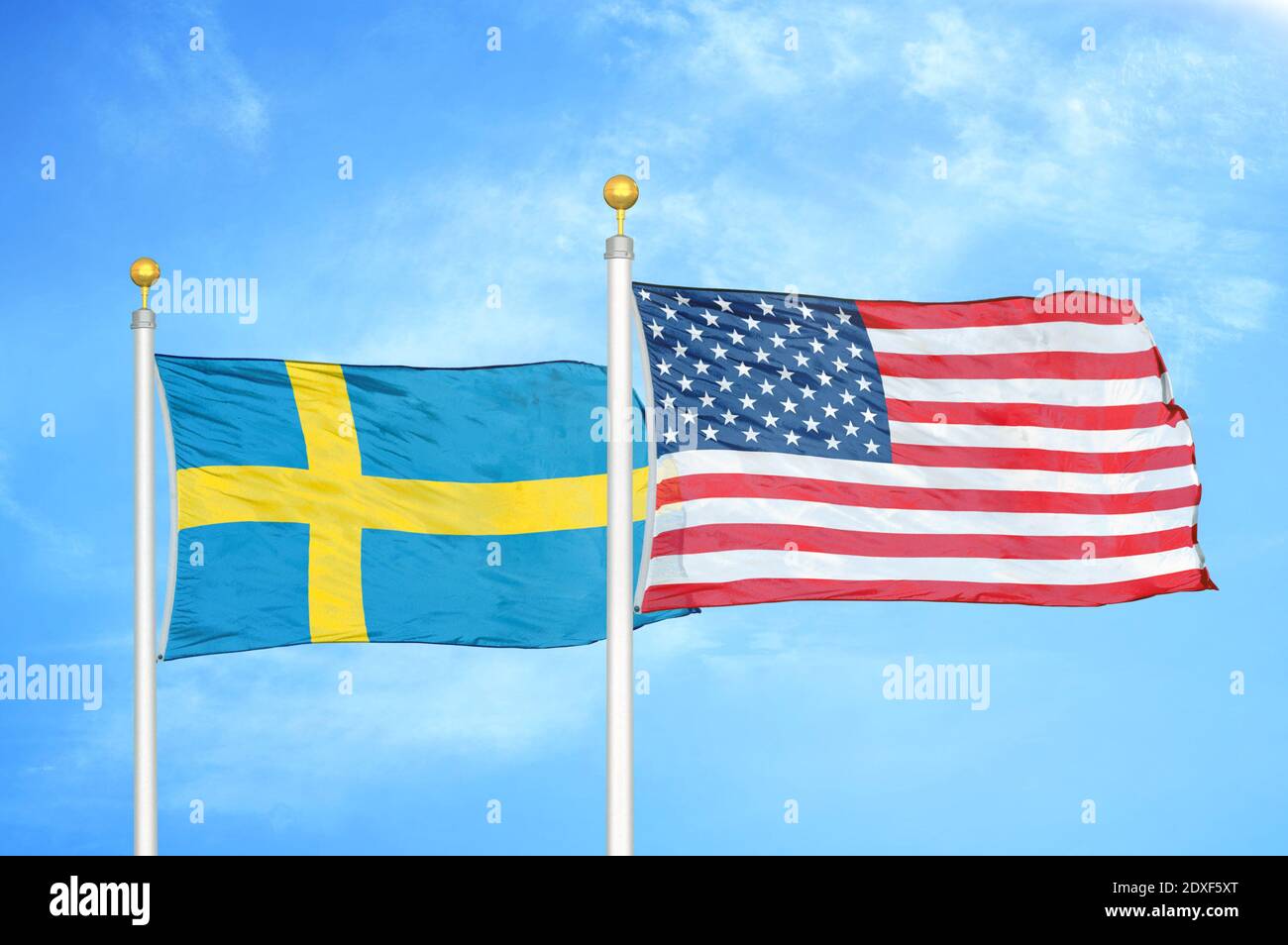 Sweden and United States two flags on flagpoles and blue sky Stock ...