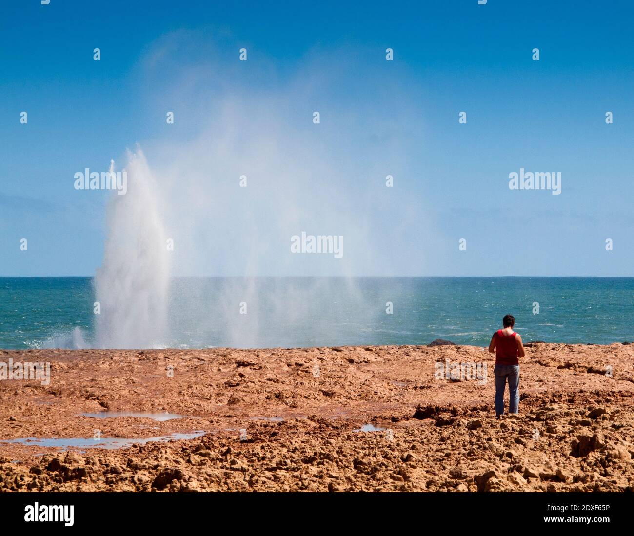 Tourist at the Blowholes, Point Quobba, Gascoyne Coast north of ...