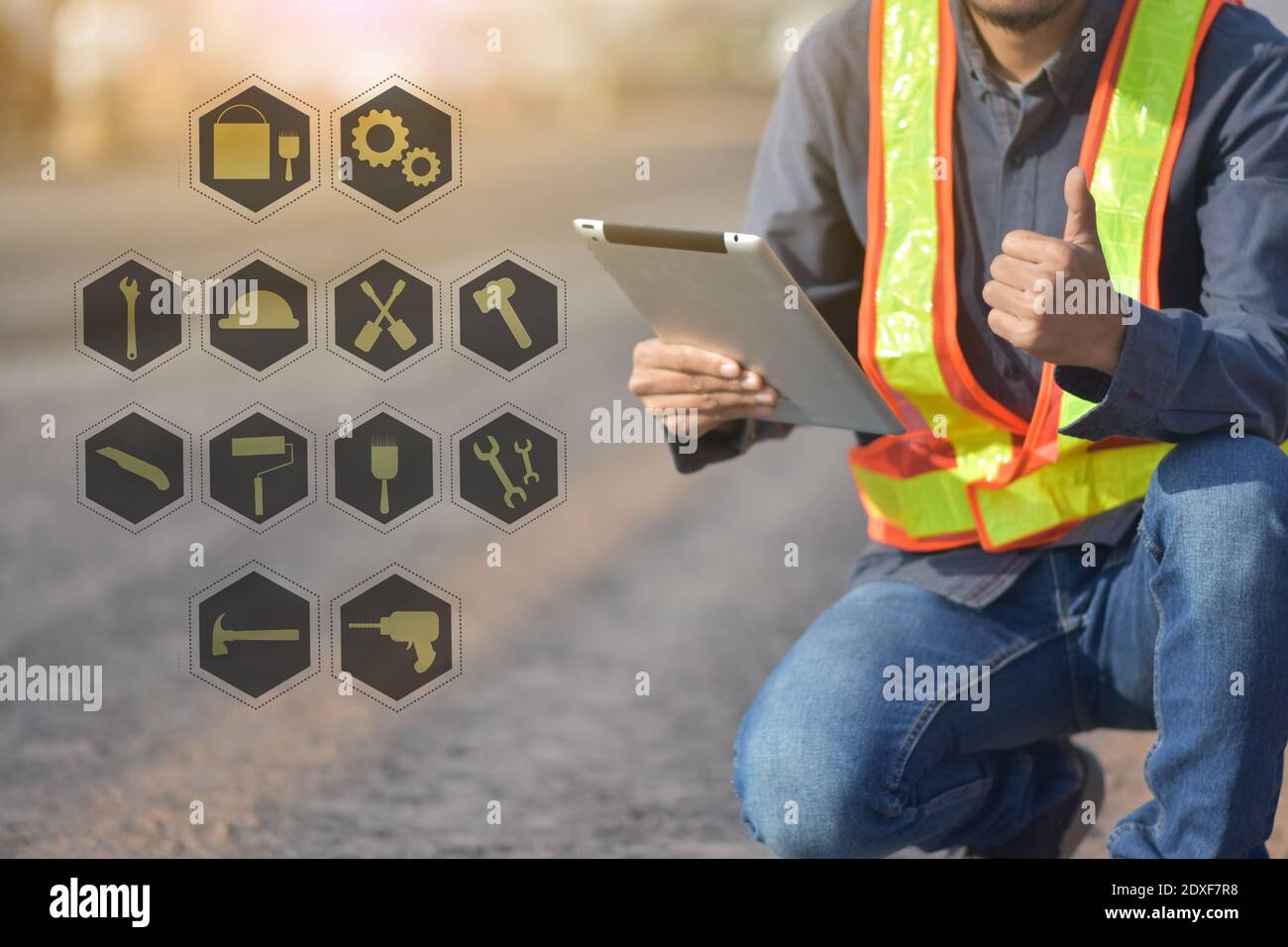 Construction Engineering holding tablet and choice tools equipment ...