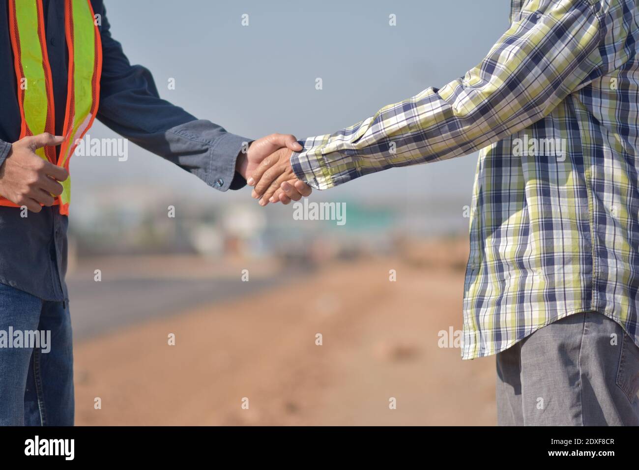 Engineering hands shake at work place building construction estate ...