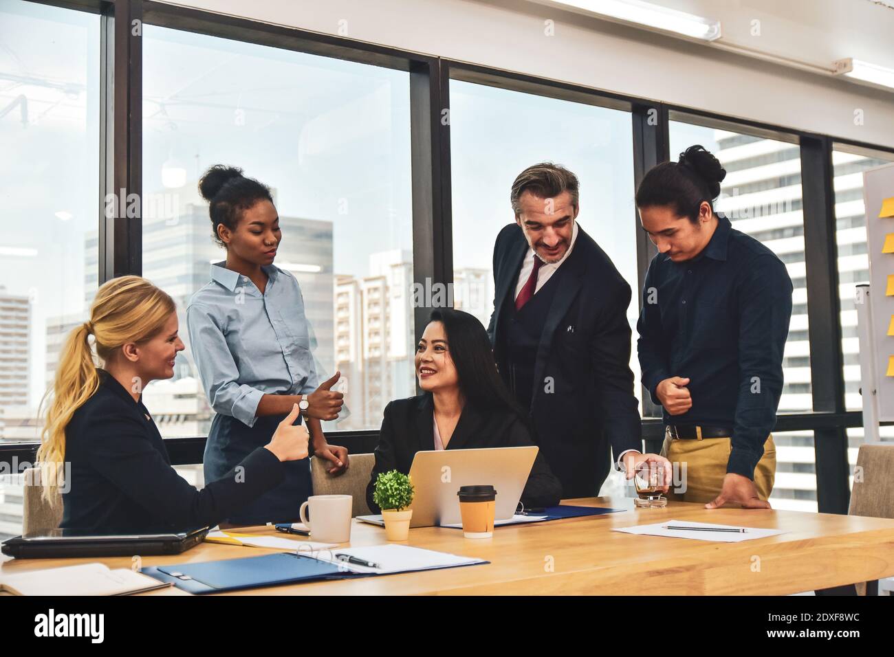 Group meeting professional businesswomen thinking hi-res stock ...