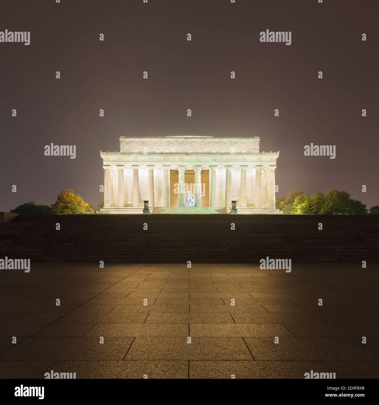 USA, Washington DC, Pavement in front of illuminated Lincoln Memorial ...