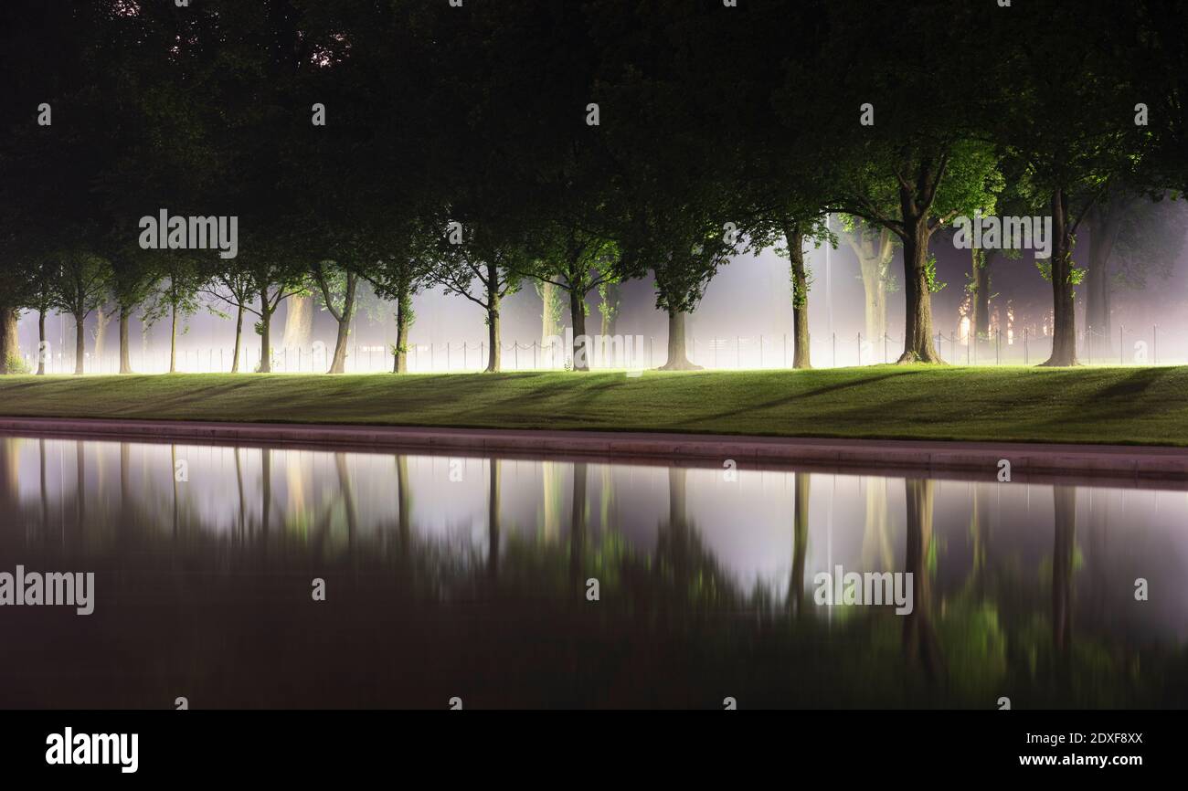 USA, Washington DC, Treelined edge of Lincoln Memorial Reflecting Pool ...