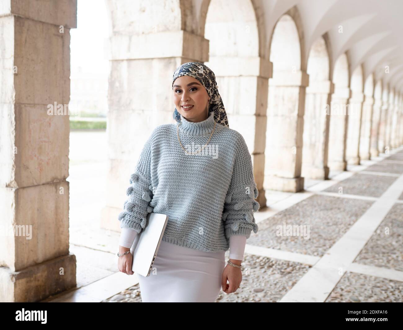 Woman walking business corridor holding hi-res stock photography and ...