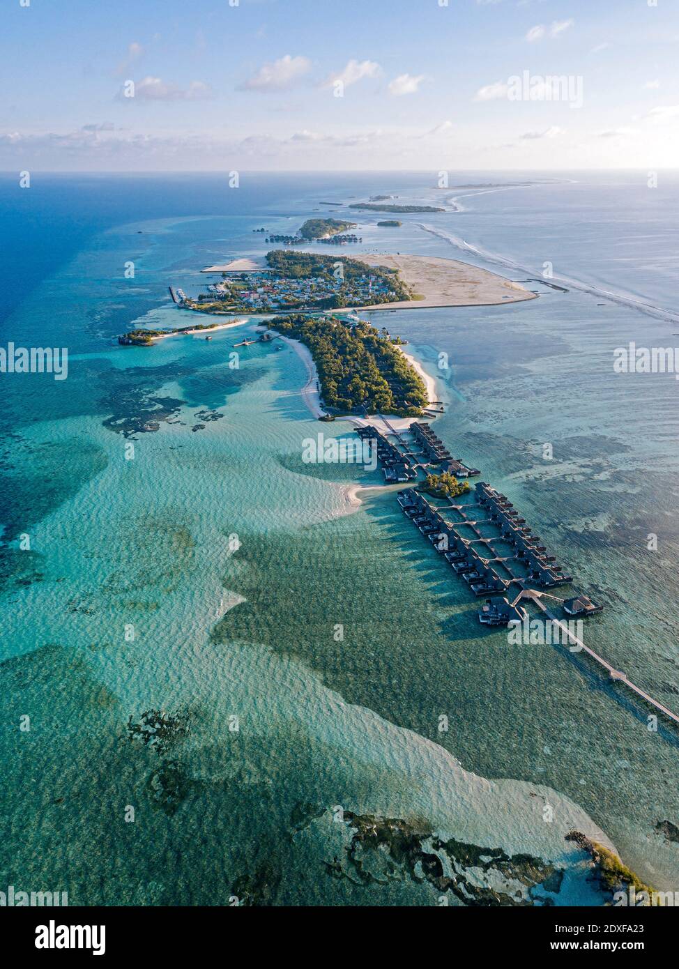 Maldives, Kaafu Atoll, Aerial view of bungalows of tourist resort on ...