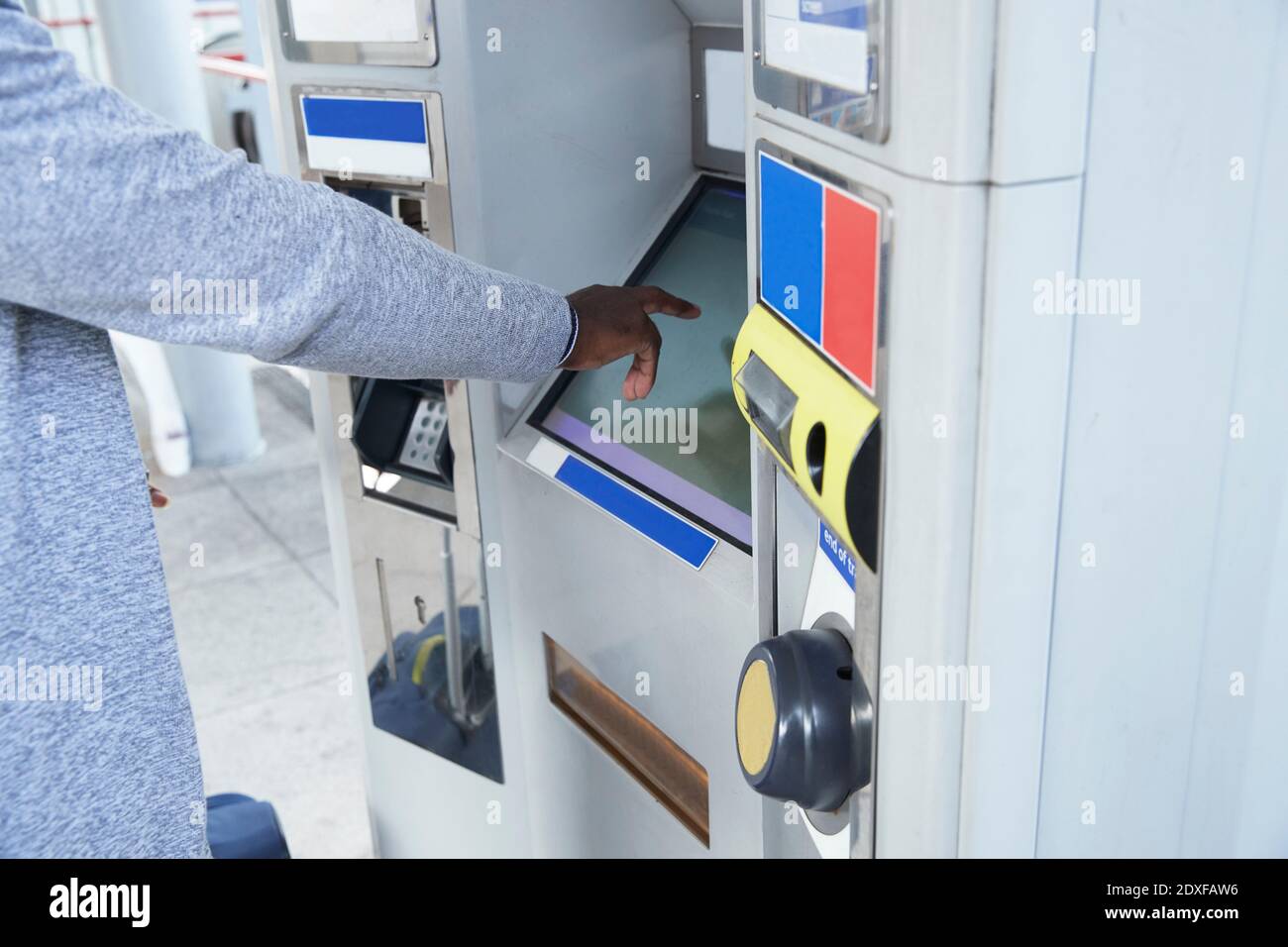 Person using train ticket machine hi-res stock photography and images ...